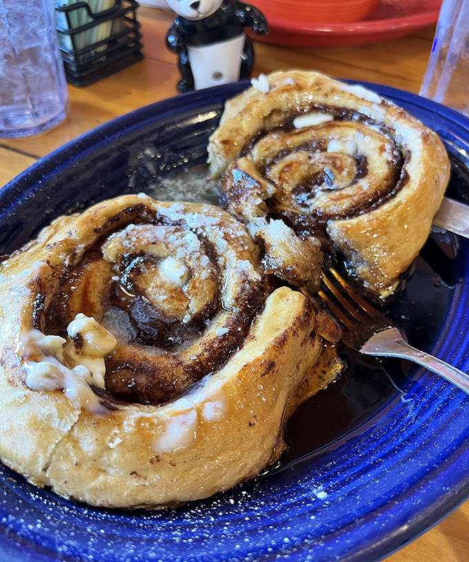 Cinnamon rolls that make you question every life decision that didn't involve ordering them sooner. The icing isn't just a topping&mdash;it's a commitment.