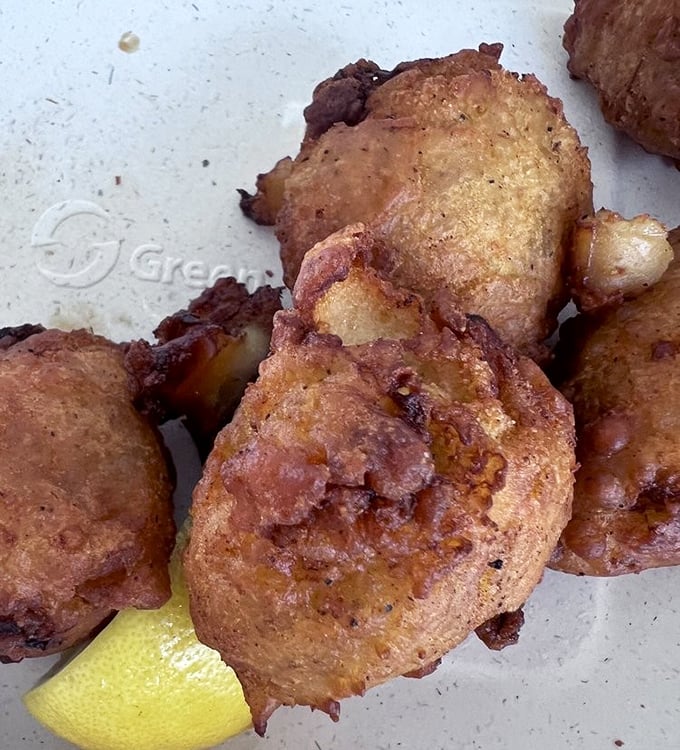 Golden-brown clam cakes that shatter with each bite&mdash;crispy exterior giving way to fluffy, briny perfection inside.