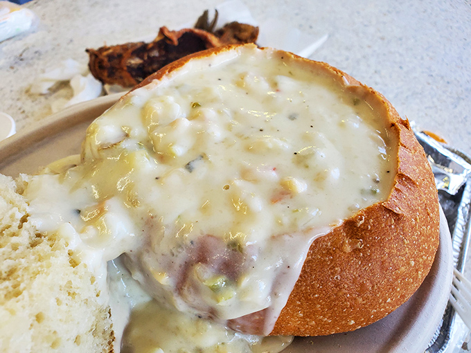 Creamy clam chowder served in a bread bowl &ndash; because sometimes your soup deserves an edible apartment.