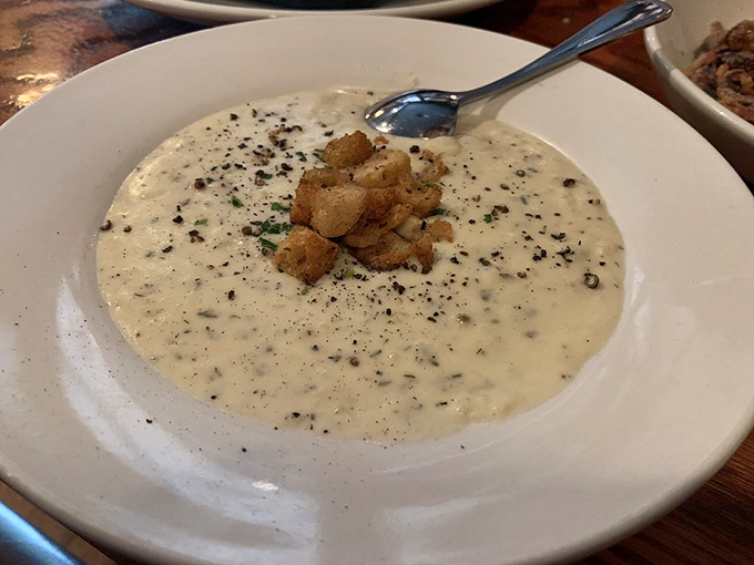 Clam chowder so creamy it should come with its own cardiologist's business card. Those croutons aren't garnish&mdash;they're little lifeboats of buttery bliss.