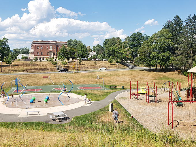 Community at its finest—this splash pad and playground combo is where childhood memories are manufactured daily.