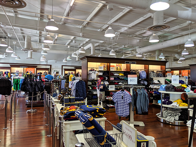 Perfectly organized racks in this store showcase the military precision of outlet shopping&mdash;everything in its place, waiting for the right bargain hunter.