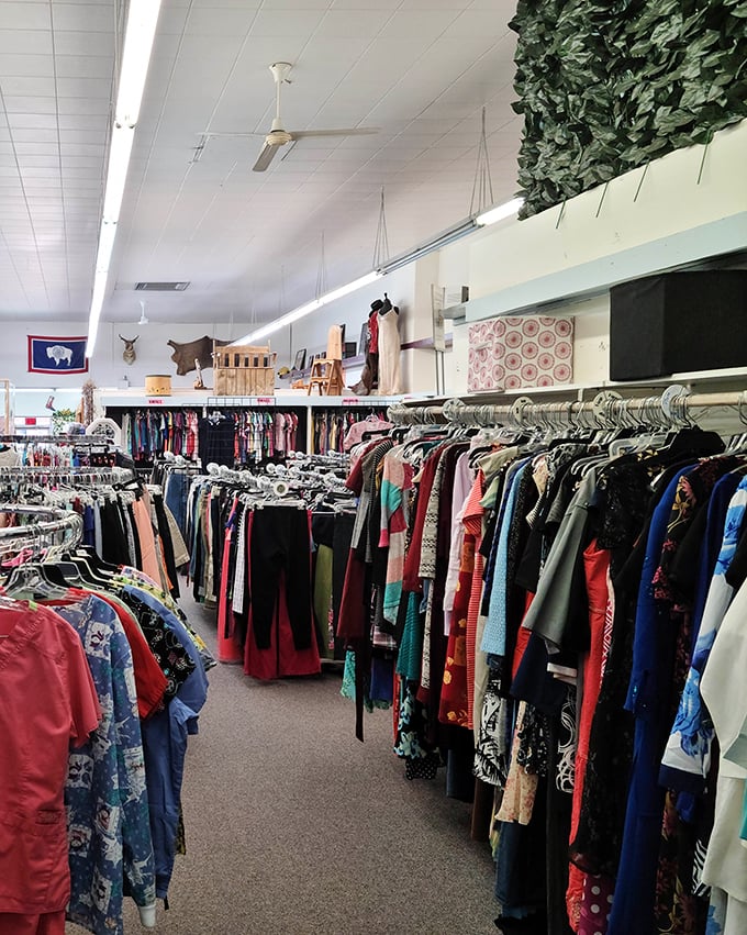 Rack after rack of clothing creates a colorful canyon of fashion possibilities where yesterday's impulse buys become today's perfect finds.