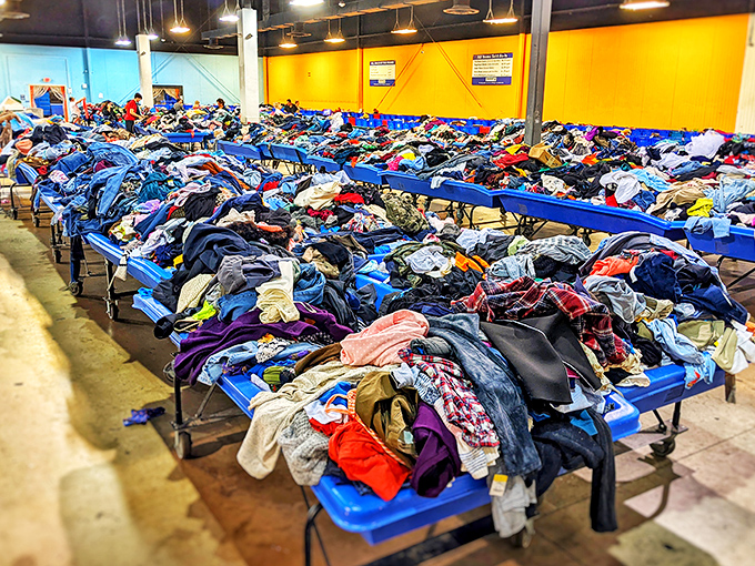 Textile mountains formed over retail eons. Seasoned shoppers develop specialized digging techniques to unearth that perfect vintage band t-shirt.