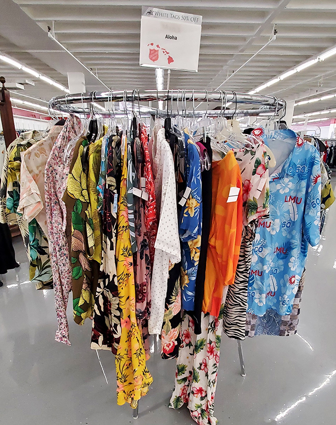 The "Aloha" rack bursts with tropical patterns and vibrant colors&mdash;each garment telling its own story of island celebrations past.
