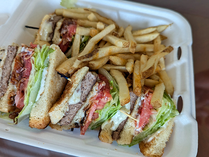 The club sandwich&mdash;architecture you can eat! Layers of goodness stacked between toast triangles with a side of golden fries.