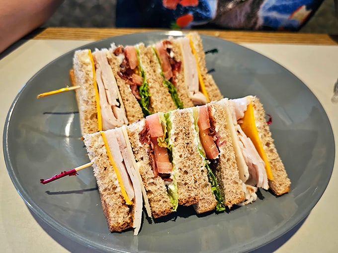 The club sandwich stands tall and proud, held together by toothpicks doing the Lord's work keeping perfection intact.