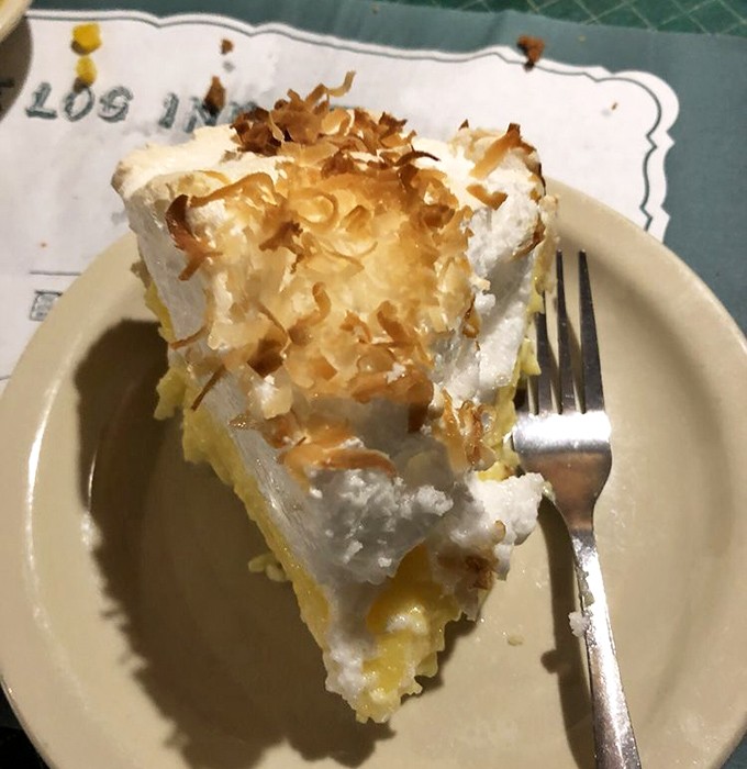 The coconut cream pie doesn't just end your meal&mdash;it elevates it. That toasted coconut topping is the crown jewel of comfort desserts. 