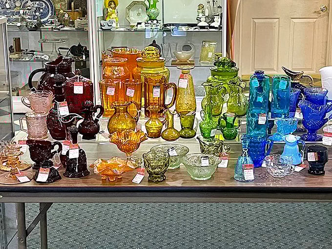 A rainbow of vintage glassware arranged by color creates an edible-looking display that's like staring into the world's most beautiful jello mold collection.