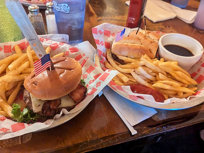 Burgers that demand both hands and your full attention. Those little American flags aren't just decoration&mdash;they're claiming territory in the name of deliciousness.