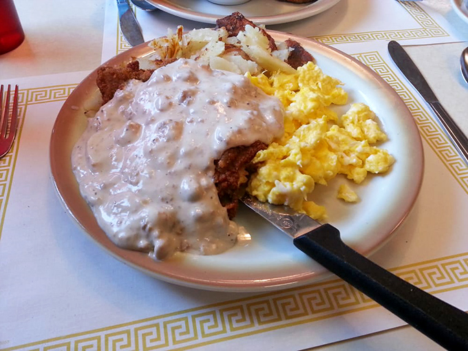 Country fried steak swimming in creamy gravy&mdash;the kind of breakfast that fuels steel workers and software engineers alike with unapologetic deliciousness.
