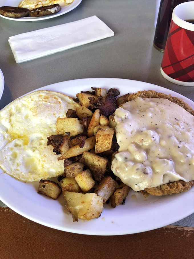Country fried steak drowning in peppered gravy – this is what Sunday mornings were invented for, folks.