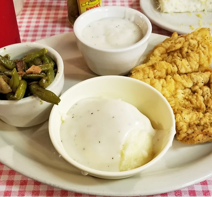 Golden country fried steak with all the fixings proves that some classics never go out of style.