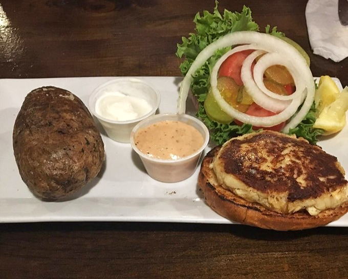 The perfect crab cake sandwich doesn't exi— Oh wait, here it is! Served with a baked potato that could double as apartment hunting in this housing market.