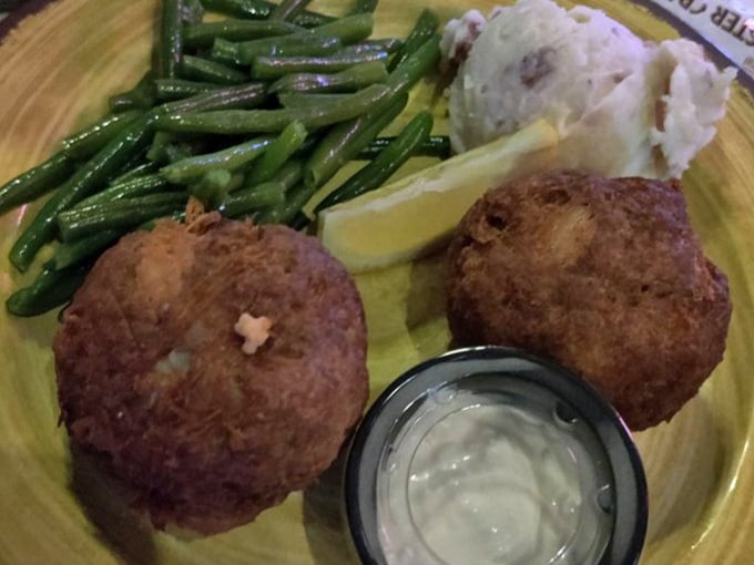 Golden-brown crab cakes that are 90% crab, 10% magic. The green beans are just there to make you feel virtuous.