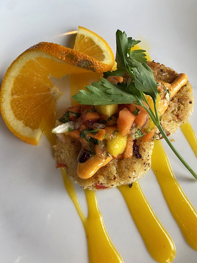 These crab cakes aren't just golden-brown perfection&mdash;they're little discs of oceanic joy, dressed up with mango salsa and a sauce that demands to be savored.