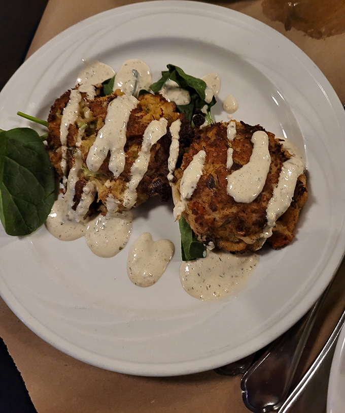 These crab cakes aren't just golden&mdash;they're the Fort Wayne equivalent of winning an Oscar for seafood. The remoulade drizzle adds just the right amount of sassy tanginess.