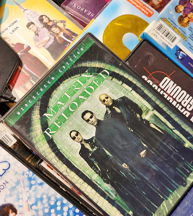 The Matrix DVD nestled among forgotten films&mdash;proof that even Keanu's digital world needed a second chance before becoming a classic.