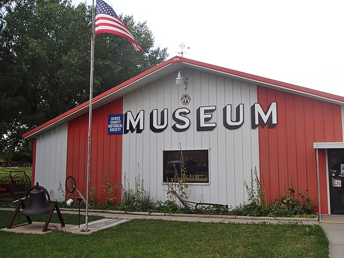 The Dawes County Historical Museum stands proudly with its American flag, a red-and-white love letter to local heritage.