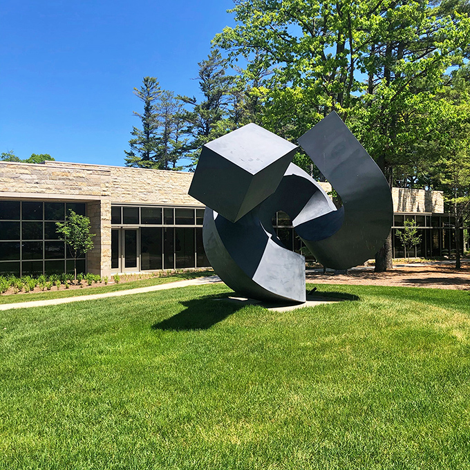 Modern art meets nature at the Dennos Museum, where geometric sculptures create conversations with the sky while visitors debate what it all means.