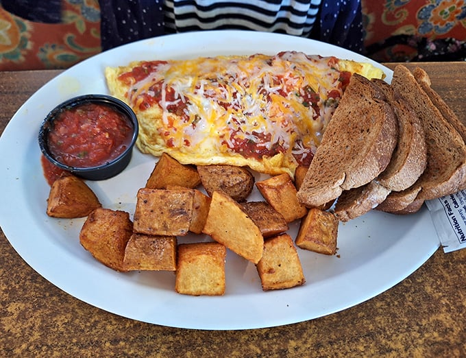 A Denver omelet that would make Colorado jealous, served with home fries that achieve that perfect crisp-tender balance.