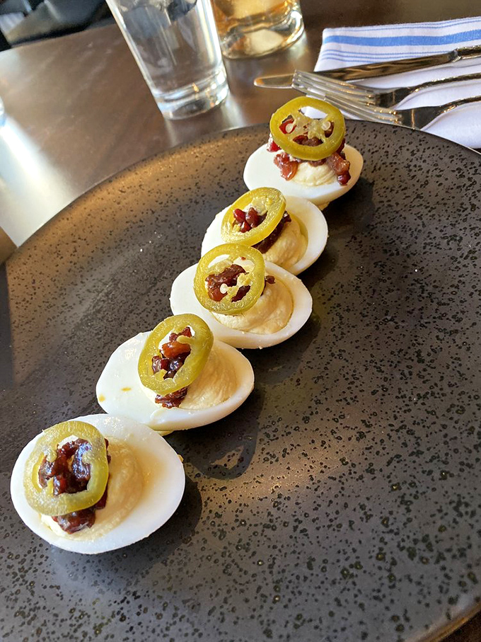 Deviled eggs wearing jalape&ntilde;o hats and bacon confetti&mdash;proof that sometimes the classics just need the right accessories.