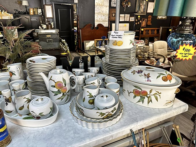 A complete fruit-patterned dinnerware set that would make Martha Stewart nod in approval sits patiently waiting for its second chapter in someone's dining room.