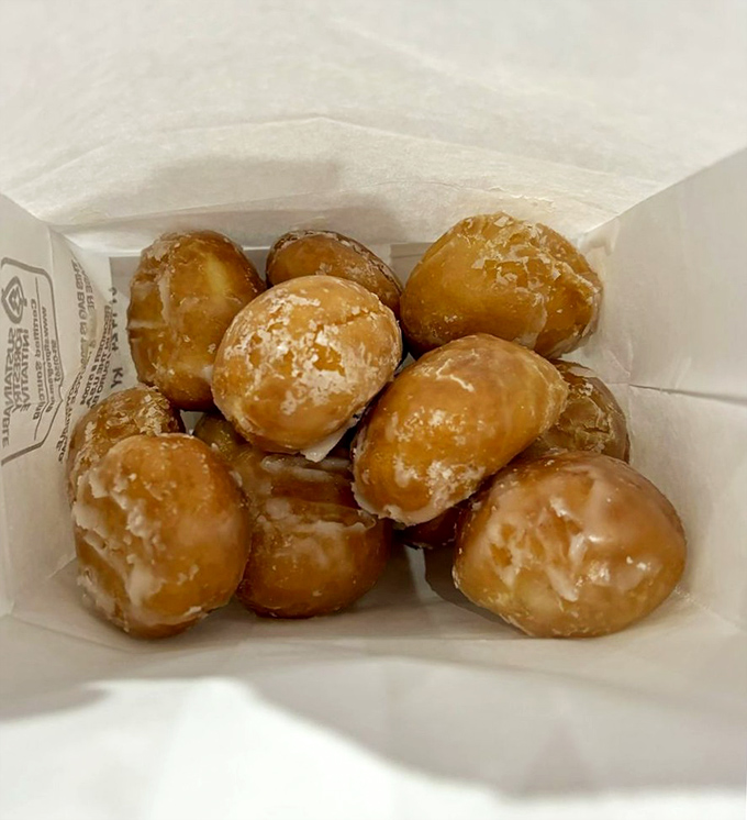 Donut holes: nature's perfect solution to portion control anxiety. "I'll just have one," you say, before demolishing the entire box of these golden-glazed spheres of joy.