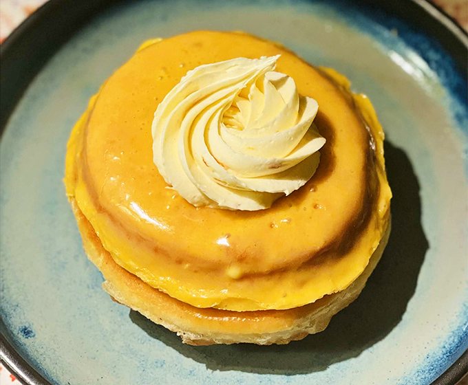 Sunshine on a plate: This golden pastry topped with a cloud of cream is what breakfast dreams are made of&mdash;no alarm clock required.