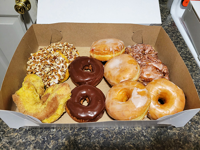A donut assortment this beautiful should come with a warning label about making life-altering delicious decisions immediately.