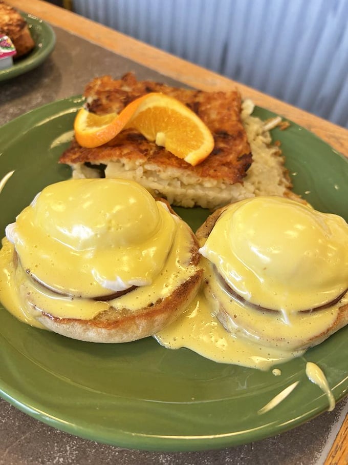 Behold the holy grail of breakfast: Eggs Benedict with hollandaise so golden it could fund your retirement. The hash browns aren't bad company either.