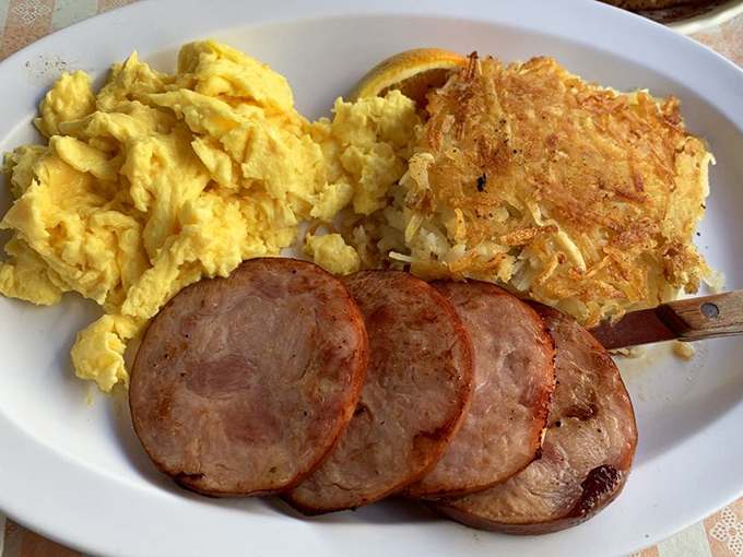 Fluffy scrambled eggs, crispy hash browns, and Canadian bacon&mdash;breakfast doesn't get more satisfying than this classic plate.
