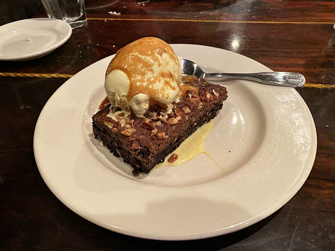 The perfect finale to a steakhouse feast &ndash; a decadent brownie topped with vanilla ice cream and caramel sauce.