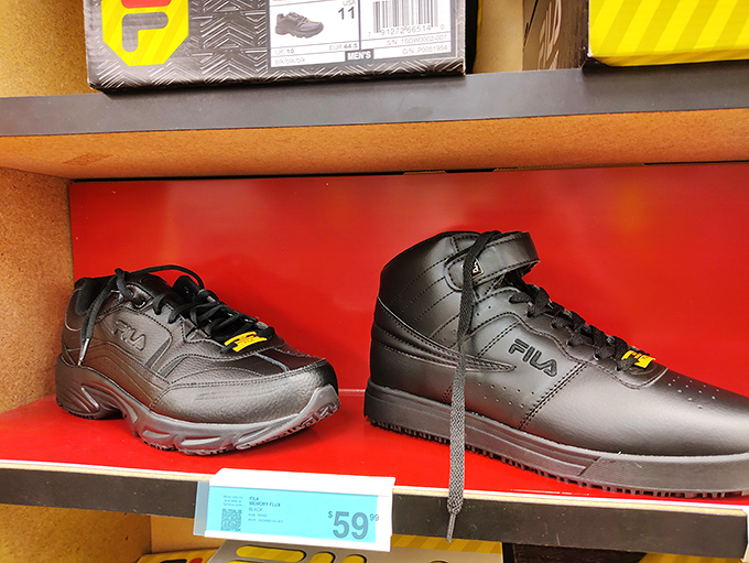 Black Fila sneakers standing at attention, ready to march home with you at prices that won't make your credit card weep uncontrollably.