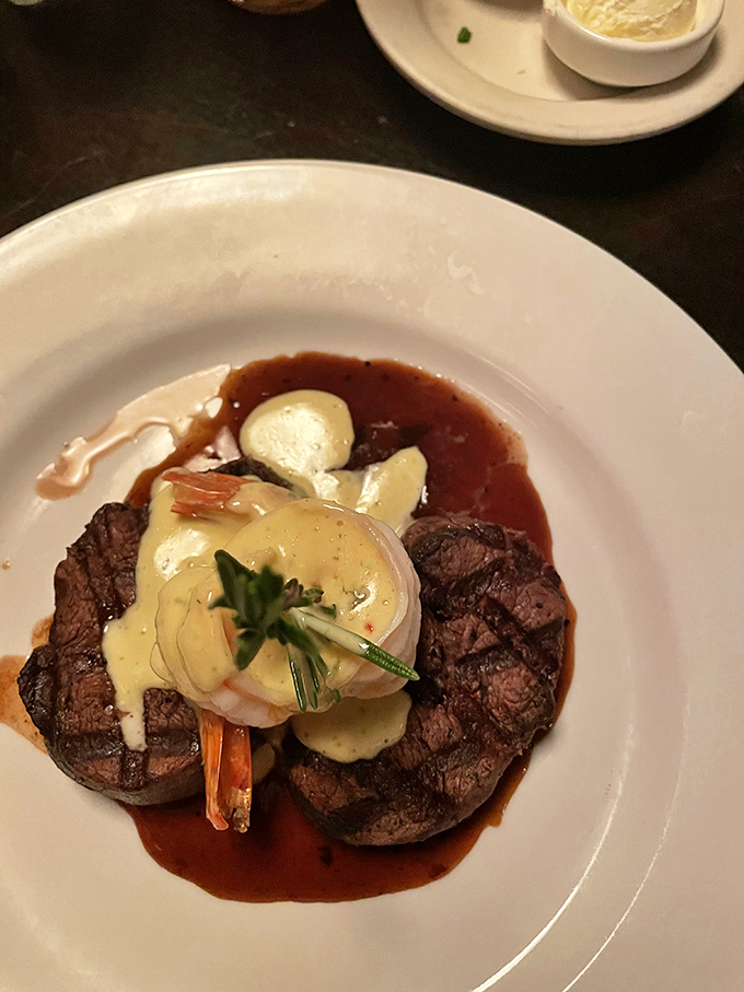 Two perfectly grilled filets, topped with shrimp and a rich sauce, making this dish feel like the ultimate surf-and-turf power play. Wowza!