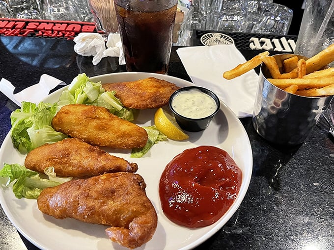 Fish and chips that would make a British pub jealous &ndash; that golden batter shatters with a satisfying crunch that echoes through the dining room.