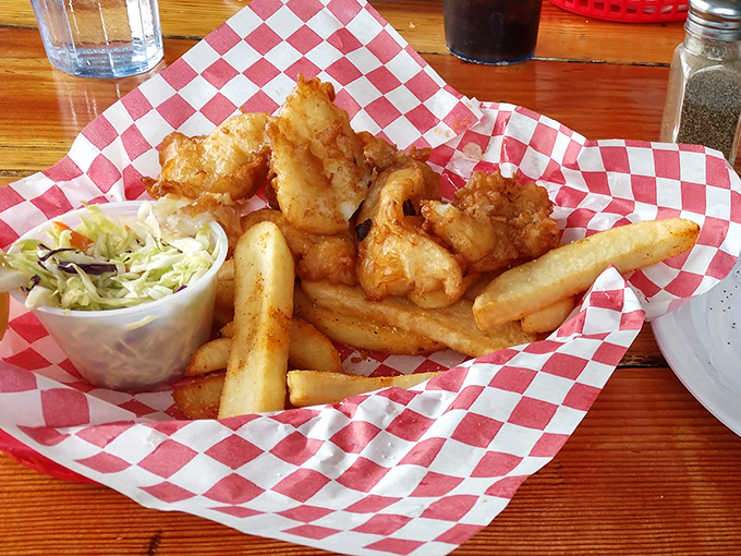 Fish and chips served in a red checkered basket&mdash;the universal language for "I'm about to make your taste buds incredibly happy."