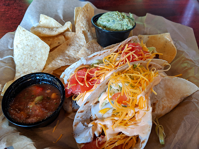 These aren't just fish tacos &ndash; they're a flavor fiesta wrapped in tortillas, with cheese that's trying to make a break for it.