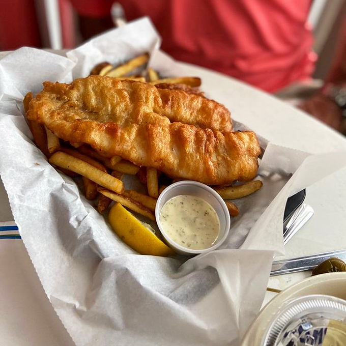 Golden-battered fish that crunches like autumn leaves, with fries that could make a Frenchman weep with joy.