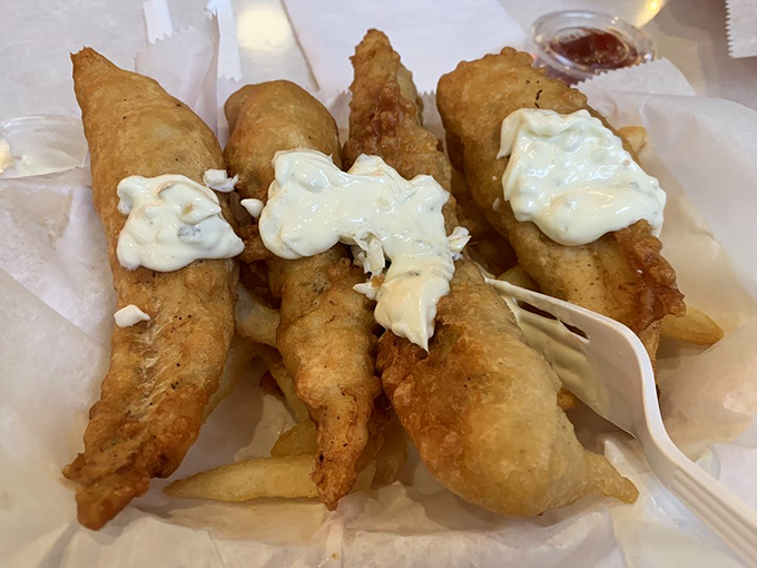 Golden-battered fish fillets that crunch with each bite, served with a side of crispy fries&mdash;comfort food that transcends coastal boundaries.