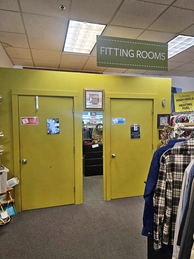 Bright yellow fitting rooms stand ready for your fashion show, where "does this still fit?" becomes the day's burning question.