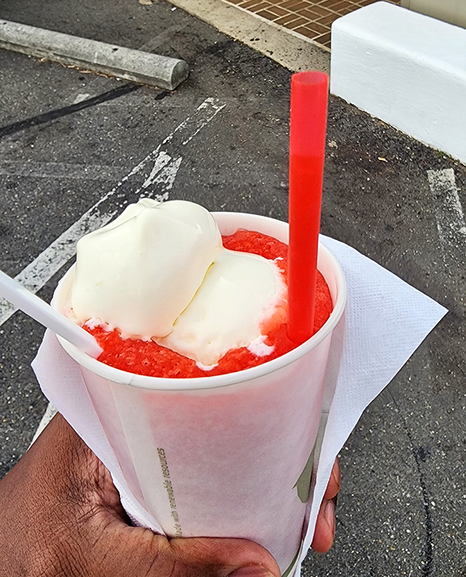 Summer salvation in a cup: a strawberry slush float that makes Virginia heat waves feel like a fair trade. Red, white, and absolutely worth the wait.