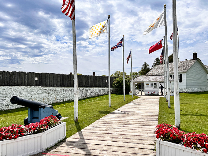 Fort Mackinac's flags flutter above limestone walls that have witnessed centuries of Great Lakes history, from British occupation to American sovereignty.