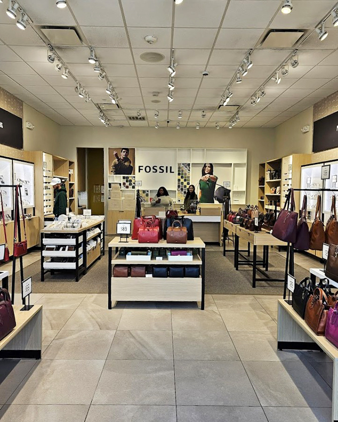 Fossil's carefully curated displays showcase handbags that whisper "investment piece" while prices shout "take me home today!" Leather goods never looked so tempting.