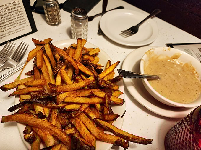 Golden fries piled high with gravy on the side – because sometimes more really is more.