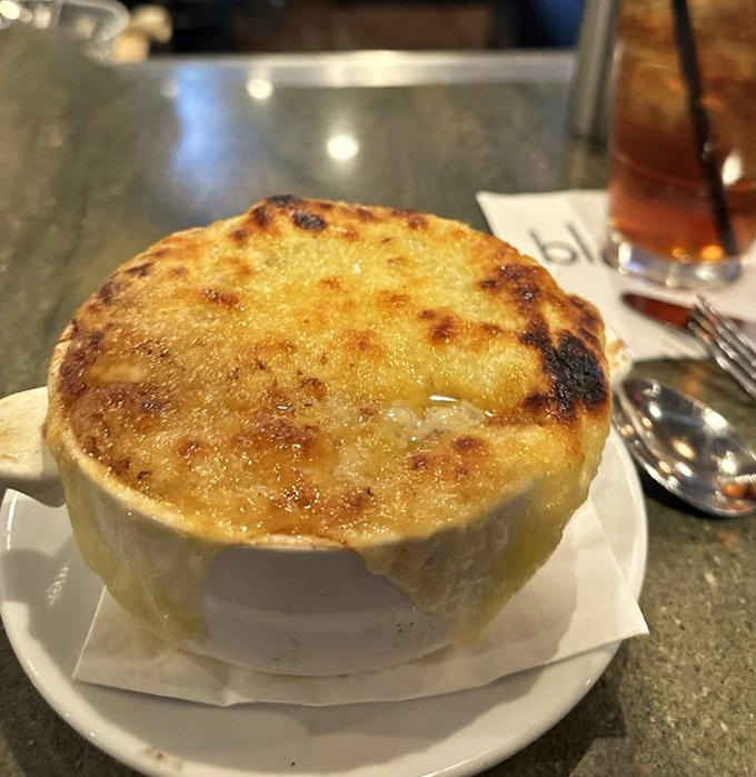 French onion soup with a cheese cap so beautifully browned, it deserves its own standing ovation.