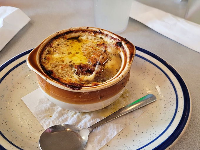 French onion soup that's worth the inevitable cheese-pull photo opportunity. That perfectly browned, bubbling cheese cap is like a savory cr&egrave;me br&ucirc;l&eacute;e for grown-ups.