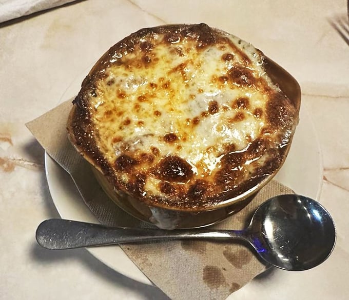French onion soup that's worth the inevitable cheese pull photo-op. That golden, bubbling crust is basically edible sunshine.