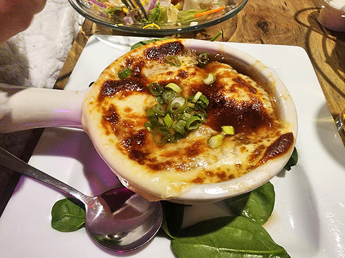 This isn't just French onion soup&mdash;it's a bubbling cauldron of comfort topped with a golden crown of melted cheese worth breaking bread for.