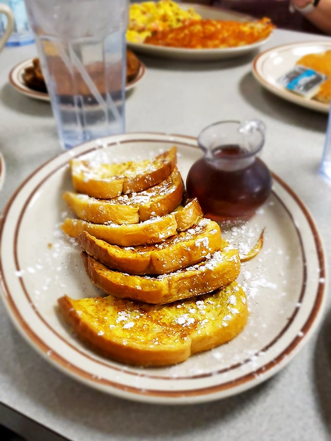 
French toast that makes you question every other breakfast you've ever had. Dusted with powdered sugar and waiting for that maple waterfall. 
